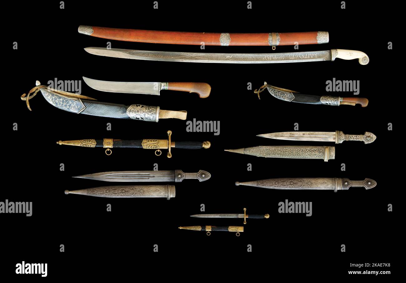 The Set of antique knives and daggers isolated on a black background ...