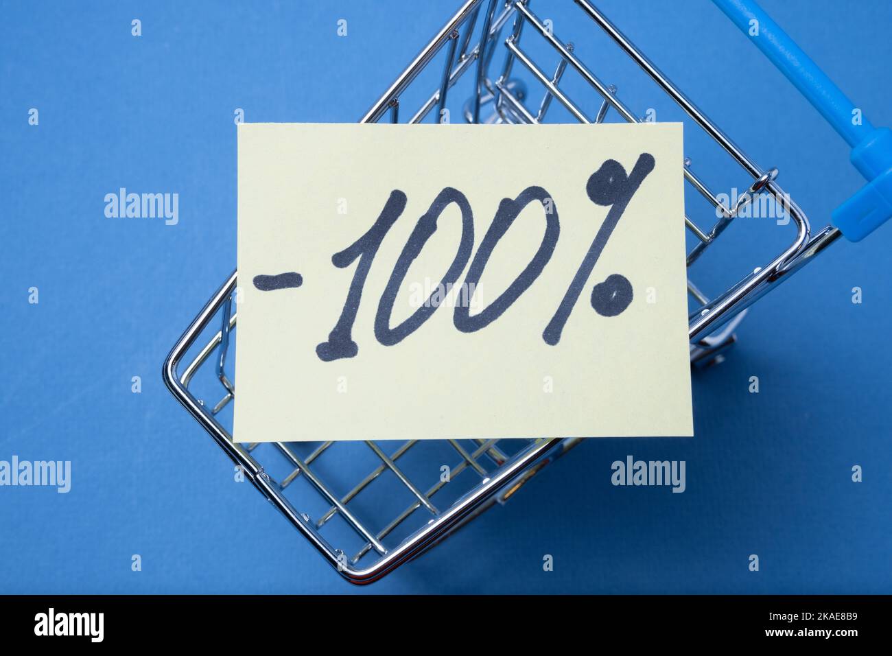 Shopping basket with a banner that says minus 100 percent Stock Photo ...