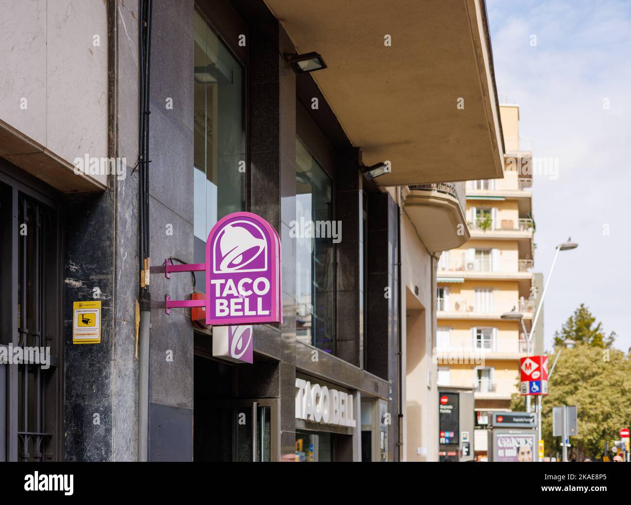 A Taco Bell fast food restaurant sign near historic sights in Barcelona ...