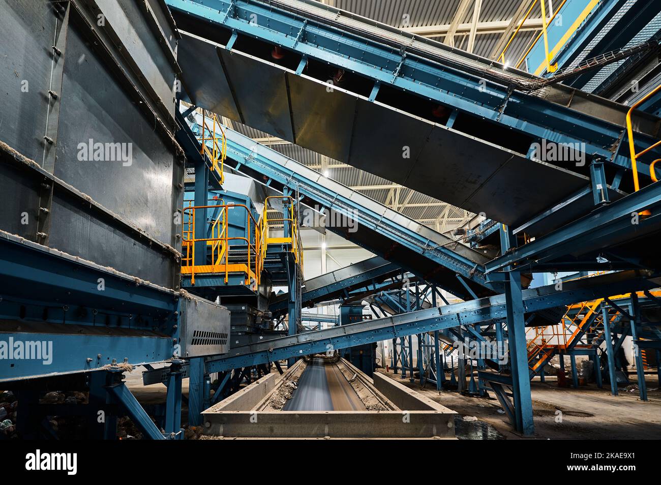 Conveyor carries trash pieces in recycling plant workshop Stock Photo ...