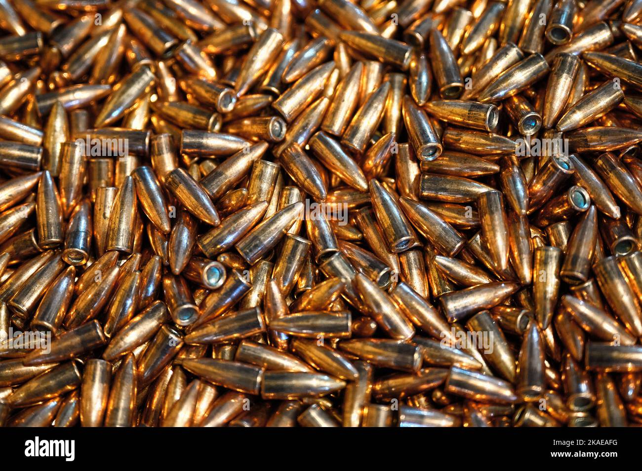Copper bullet pile for riffle as background Stock Photo - Alamy