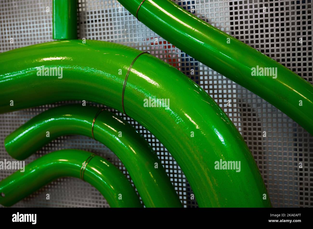 Metal pipe samples covered with green paint in store Stock Photo - Alamy
