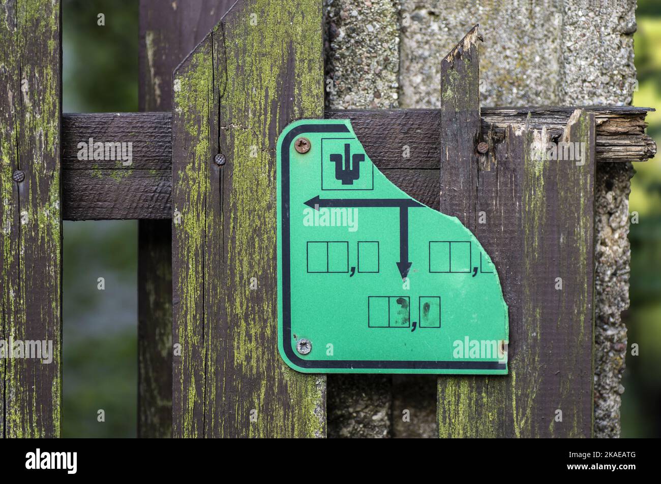 closeup fragment of old and broken fence with broken communications ...