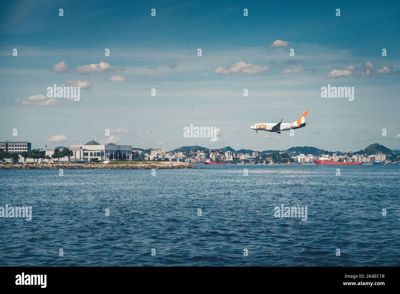 An airplane preparing for a landing over the Atlantic Ocean at the Rio ...