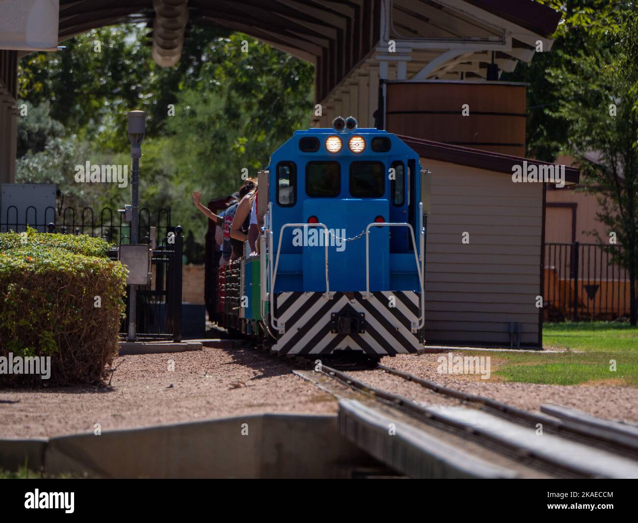 An old train going out from the station Stock Photo - Alamy