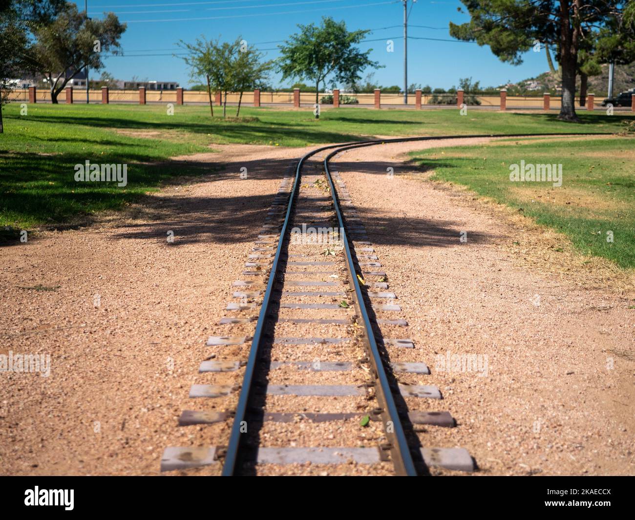 A railway track in a landscape with trees on a sunny day Stock Photo ...
