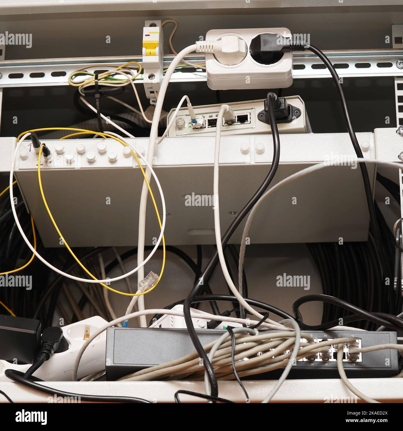 Network computer cables connected to a router or modem in the office ...