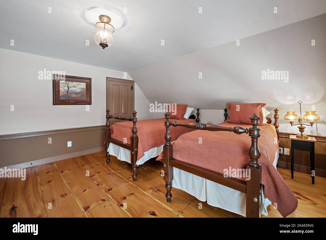 A vintage decoration of a comfortable bedroom with two old style beds ...
