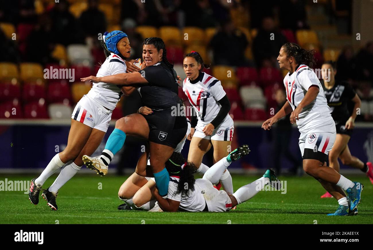 New Zealand's Amber Hall is tackled by France's Fanny Ramos and Perrine ...