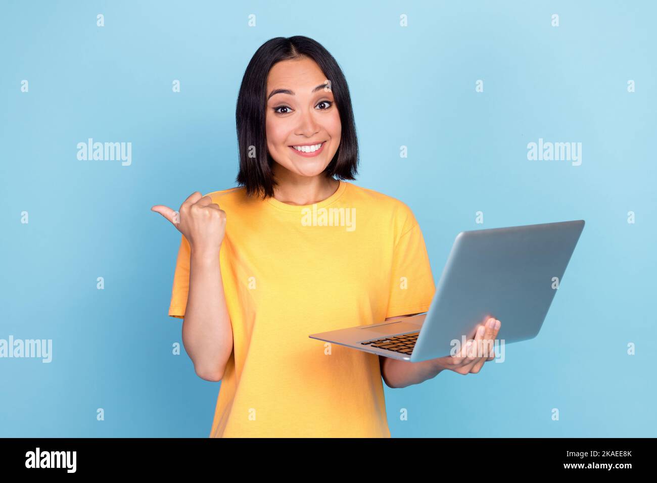 Photo of positive cheerful pretty girl bob hairdo wear yellow t-shirt ...