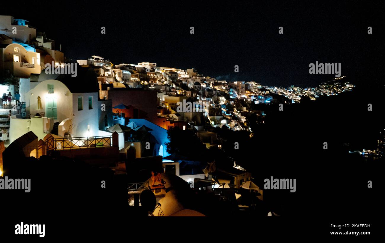 The beautiful white buildings of Santorini at night, Greece Stock Photo ...
