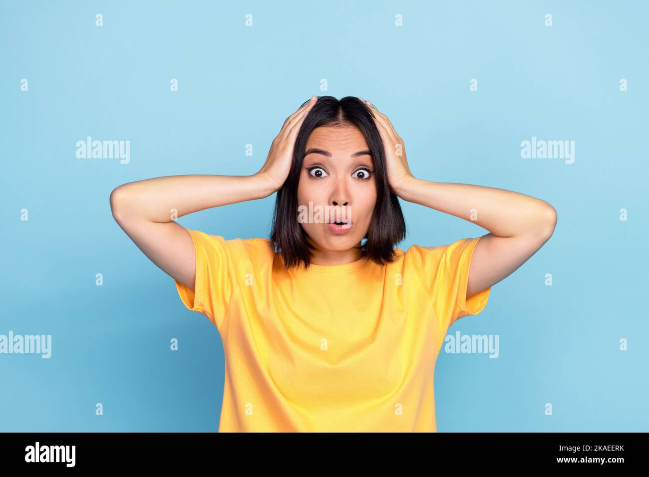 Photo portrait of lovely young woman chinese hands touch head ...