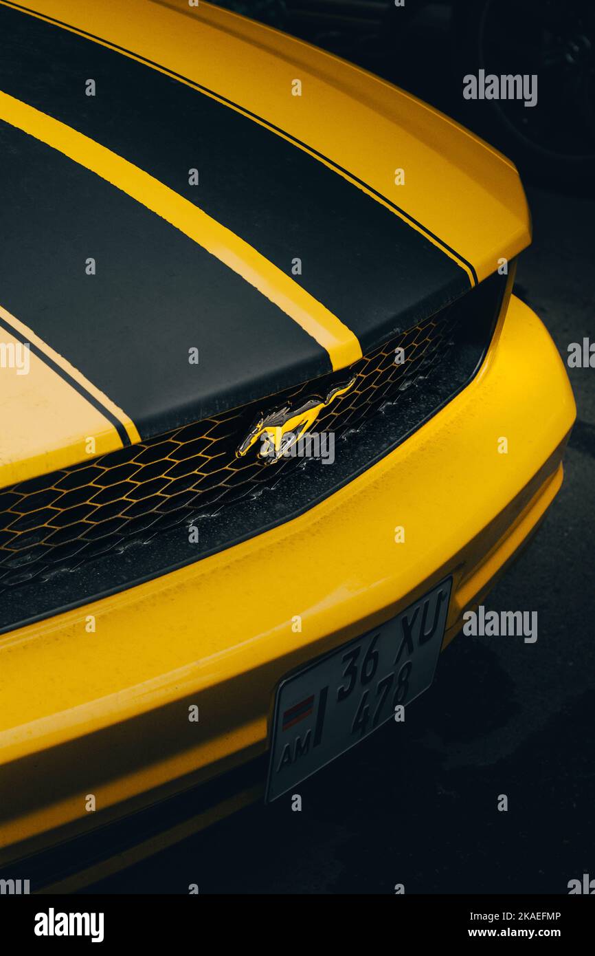 The front of yellow and black race, sport car, close-up, vertical Stock ...