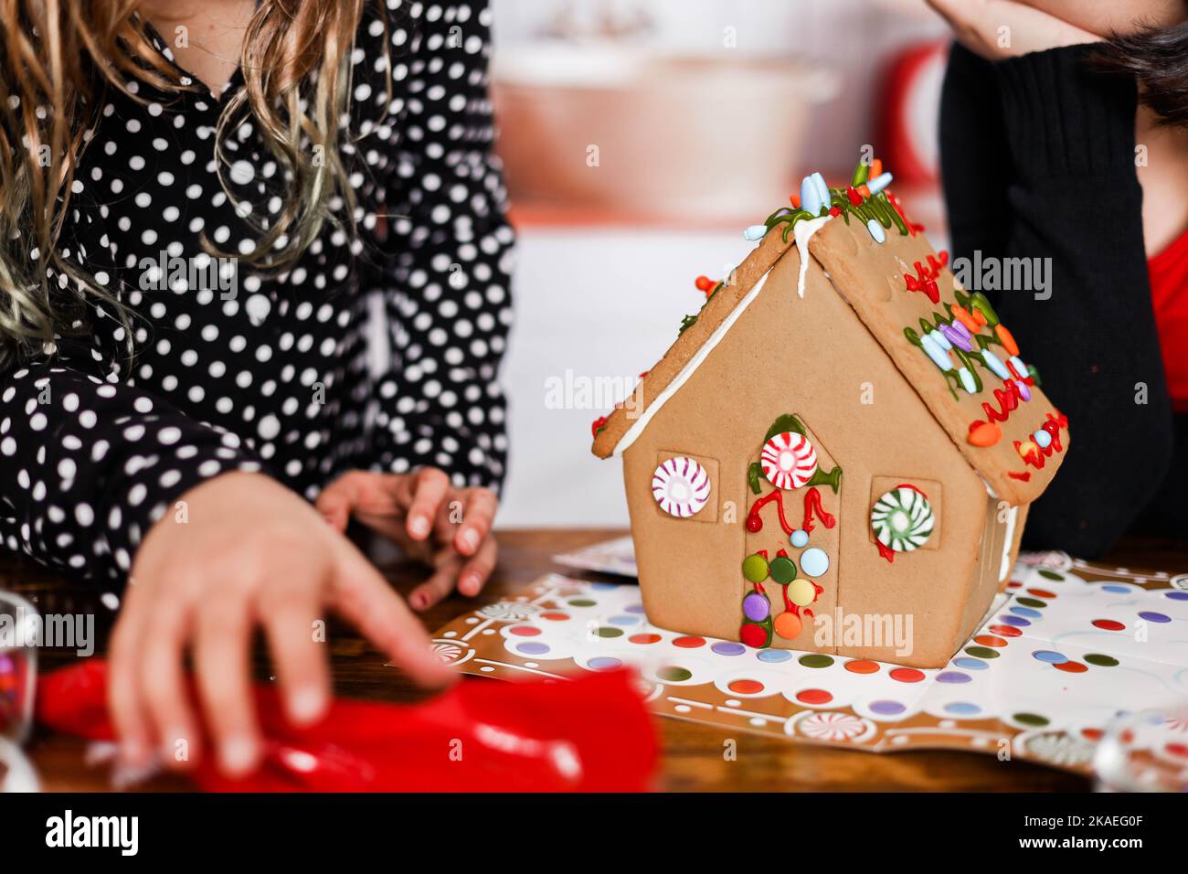 Making traditional gingerbread house for Christmas party Stock Photo ...