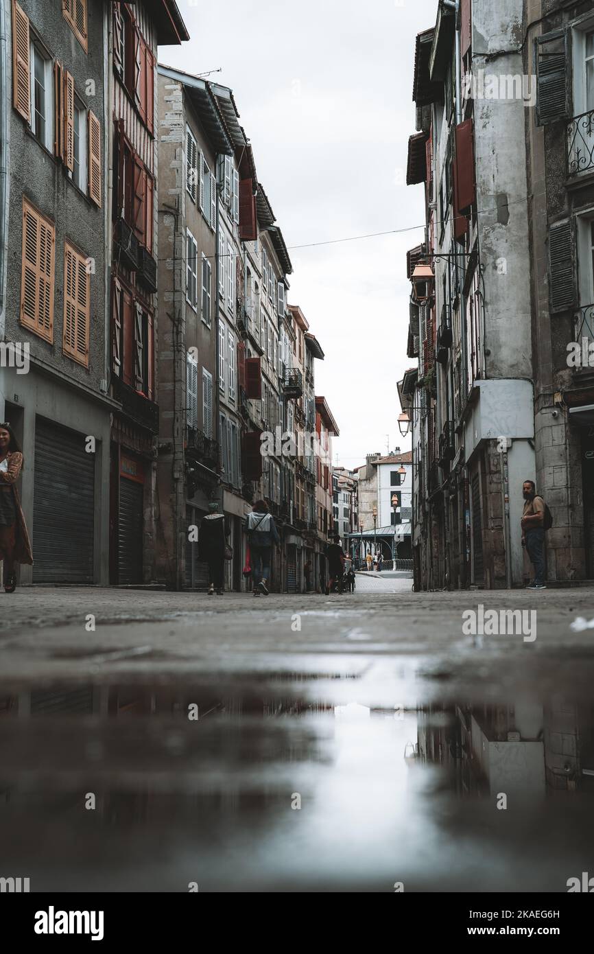 Puddle on alley street hi-res stock photography and images - Alamy
