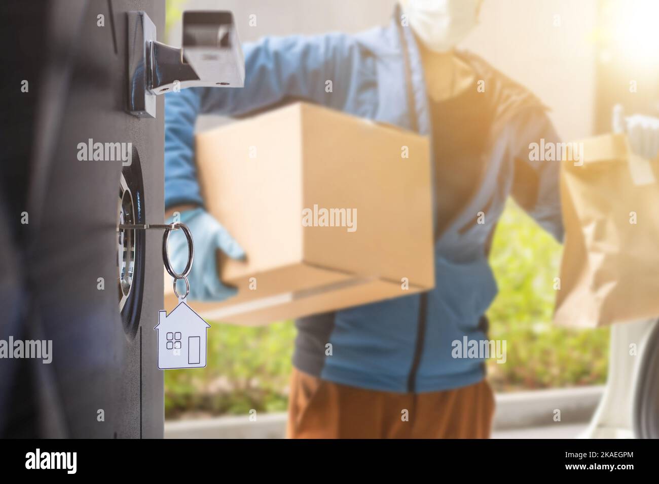 the door is open to the delivery man Stock Photo - Alamy