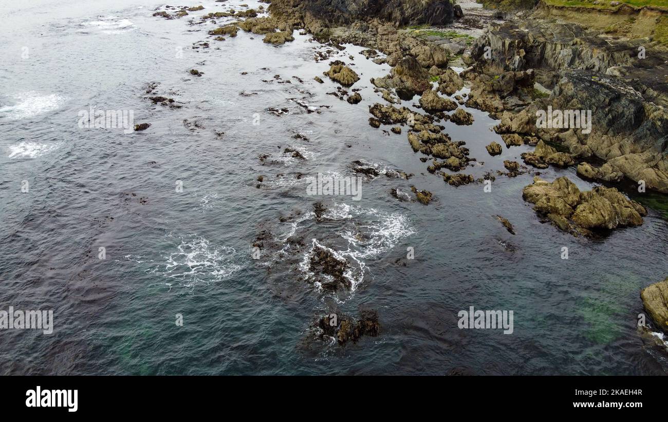 Coastal rocks under sea water, seascape. The coastline of the Atlantic ...