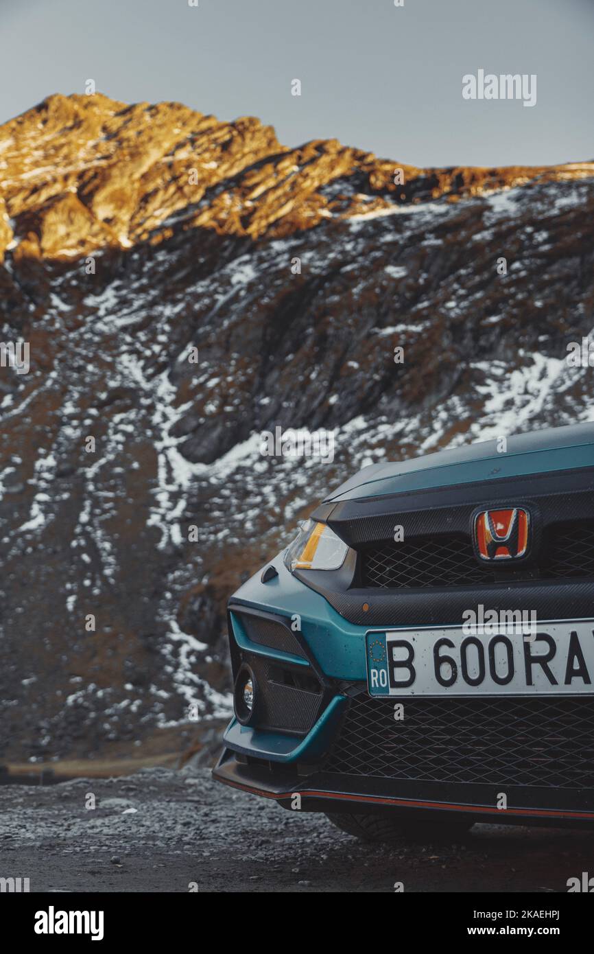 A beautiful blue Honda Civic Type-R sportscar in The Romanian mountains ...