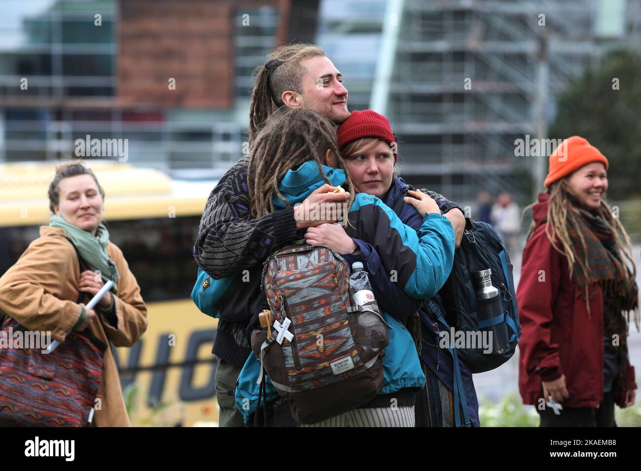Demonstrators hug in front of the Parliament House during the rally ...
