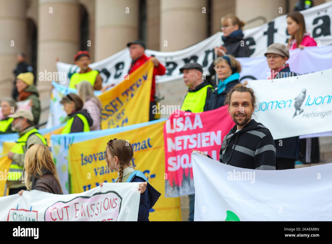 The defenders of the forest hold banners on the steps of the Parliament ...