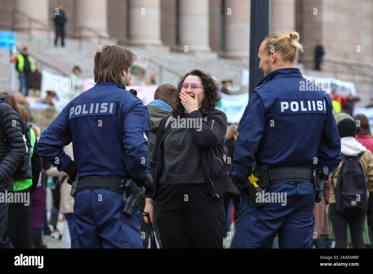 Policemen speak to a protester during the demonstration. The forest ...