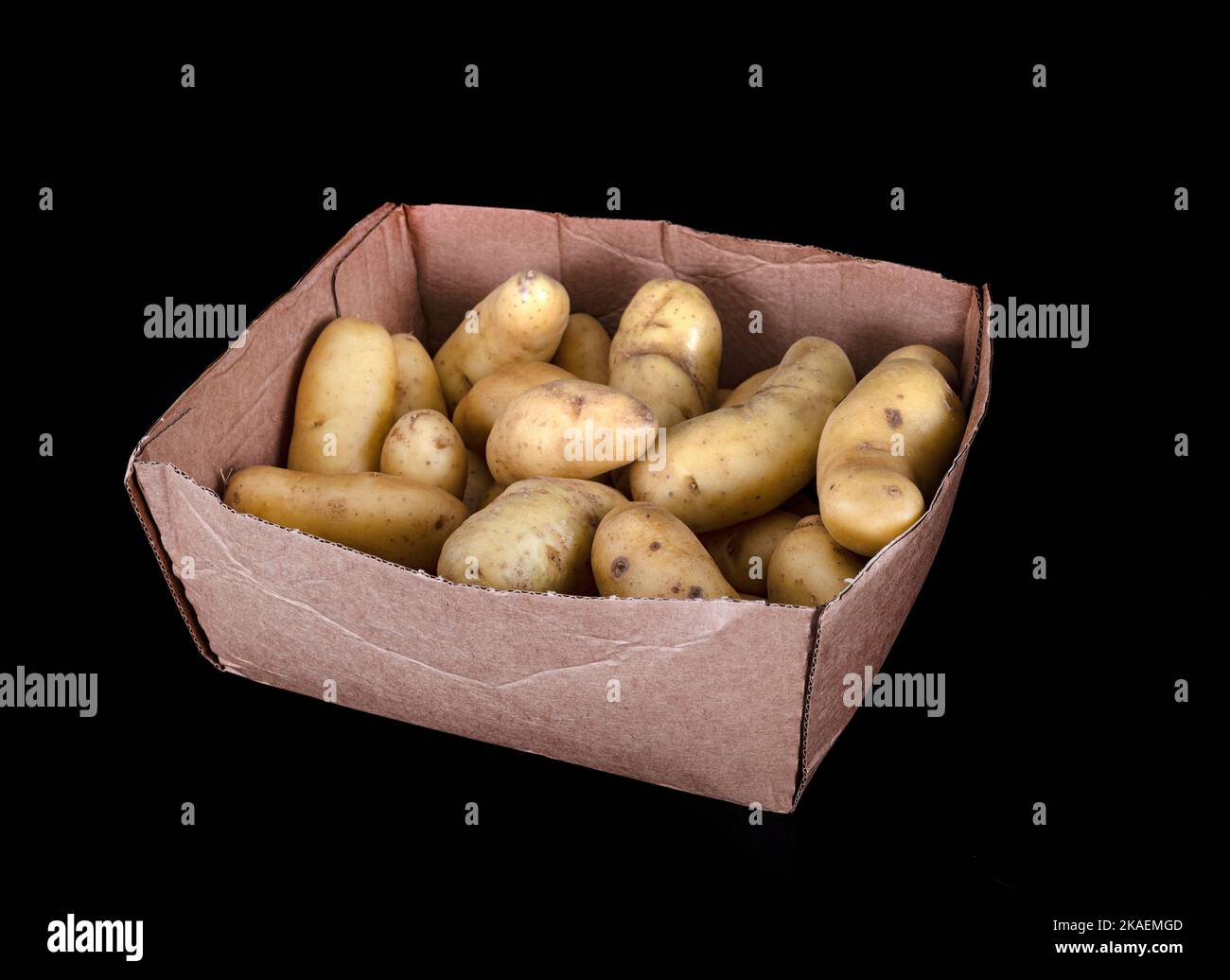 Ratte potato in front of black background Stock Photo - Alamy