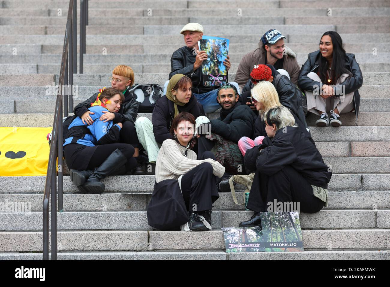 Protesters sit on the steps of the Parliament House during the ...