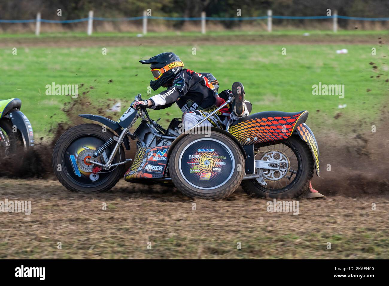 Tom Cossar & Wayne Rickards racing in grasstrack motorcycle race. Donut ...