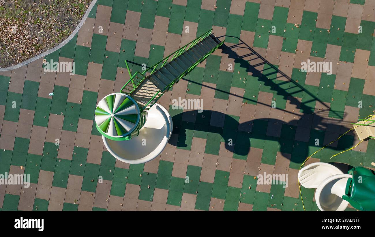 An aerial top view of playground equipment in a sunny park Stock Photo ...