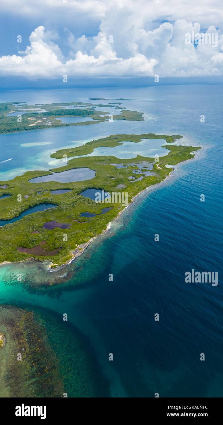 A vertical aerial view of a blue lagoon on a bright sunny day Stock ...