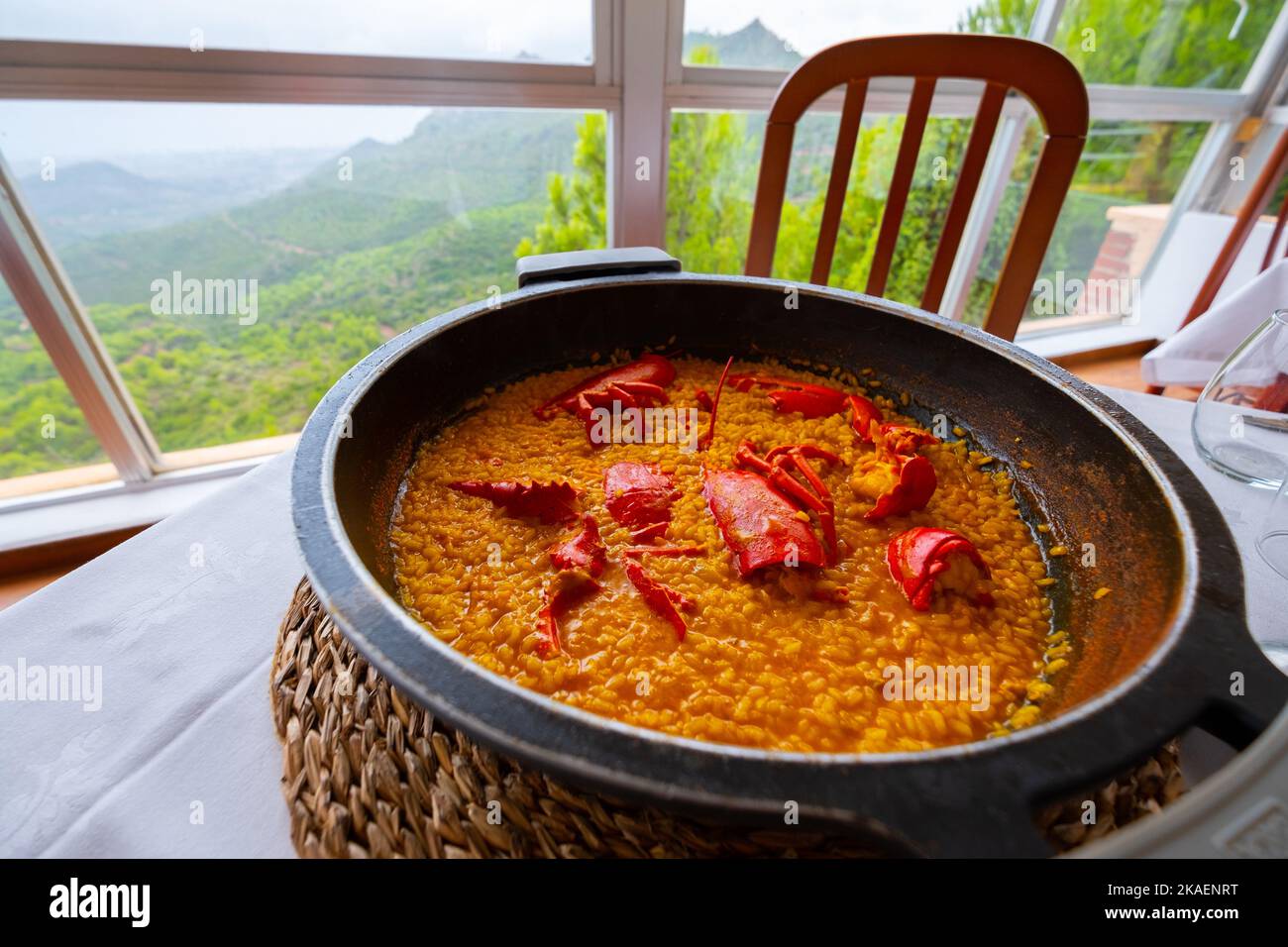 Traditional Spanish meal. Paella with a lobster. Tasty food from ...