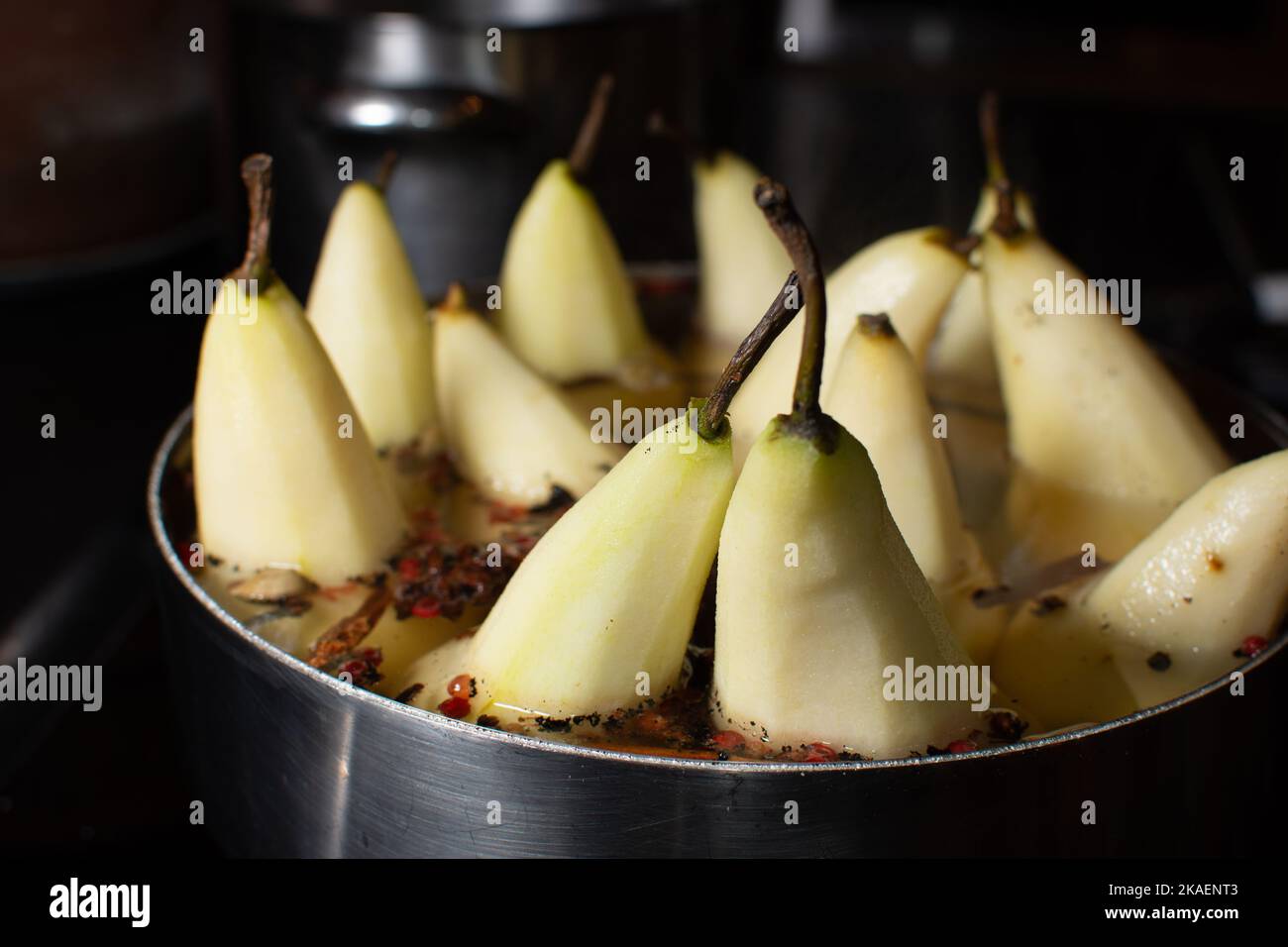 A top view of peeled pears in captured in the process of making a ...