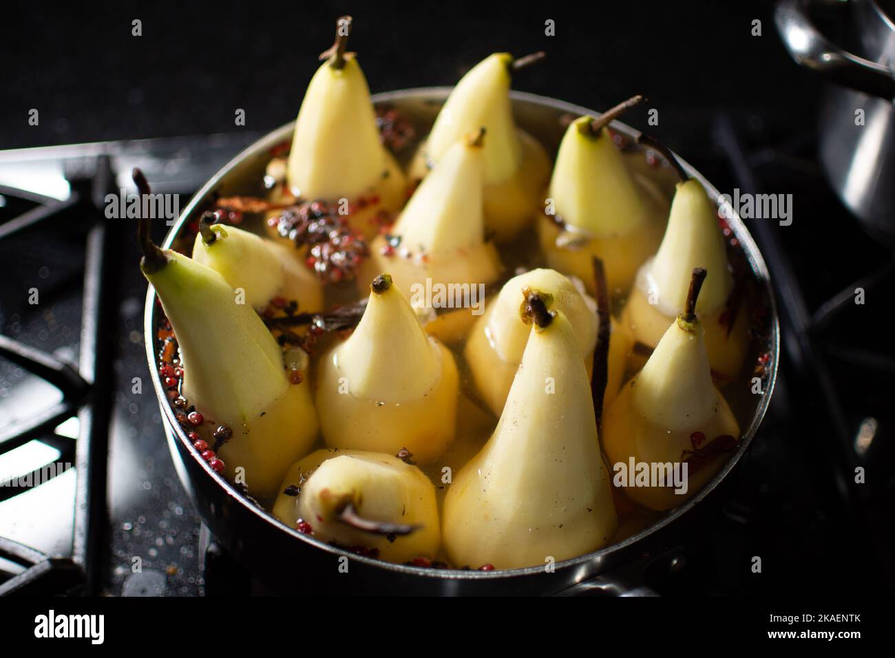 A top view of peeled pears in captured in the process of making a ...