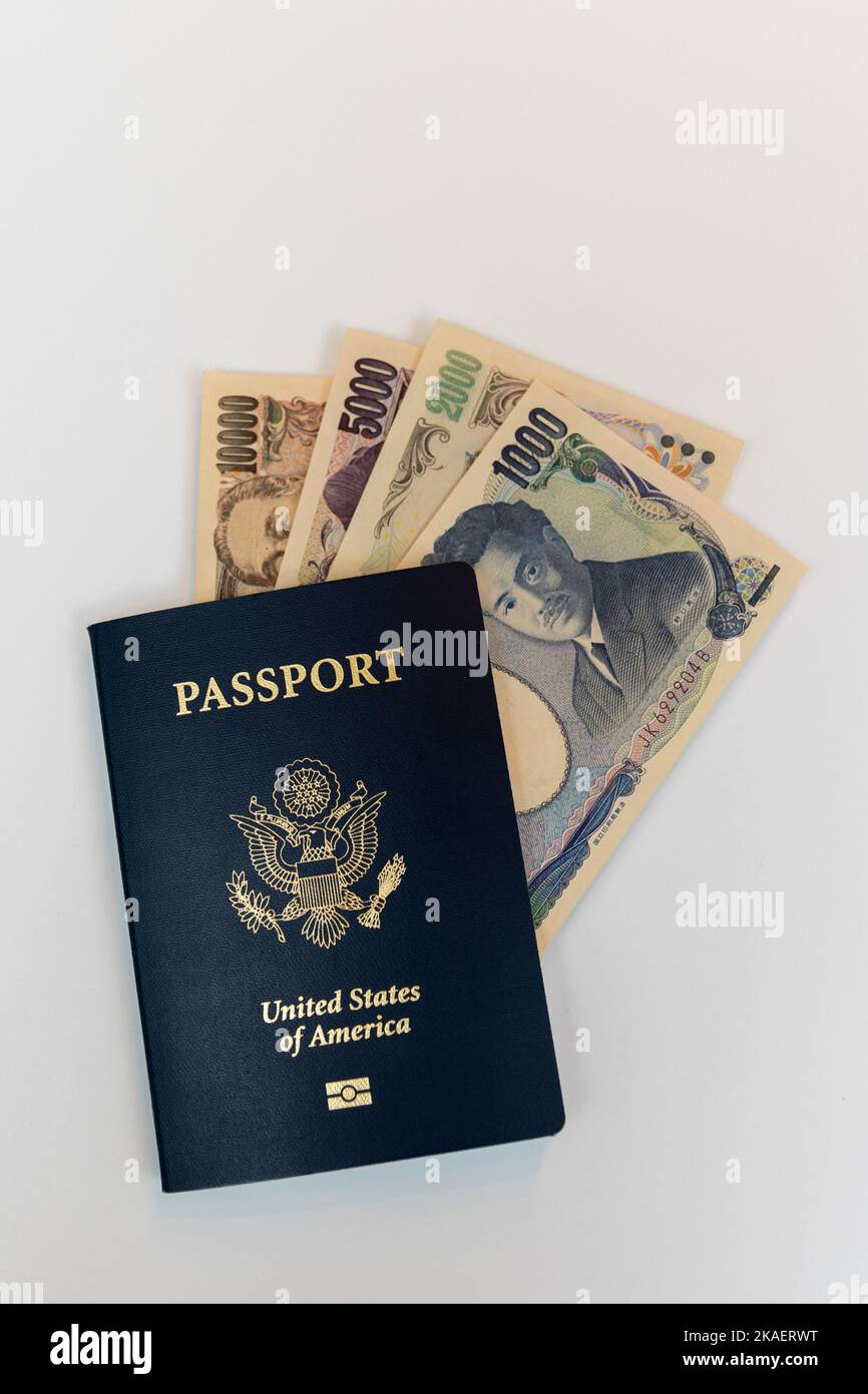 US passport and foreign paper currency Stock Photo - Alamy