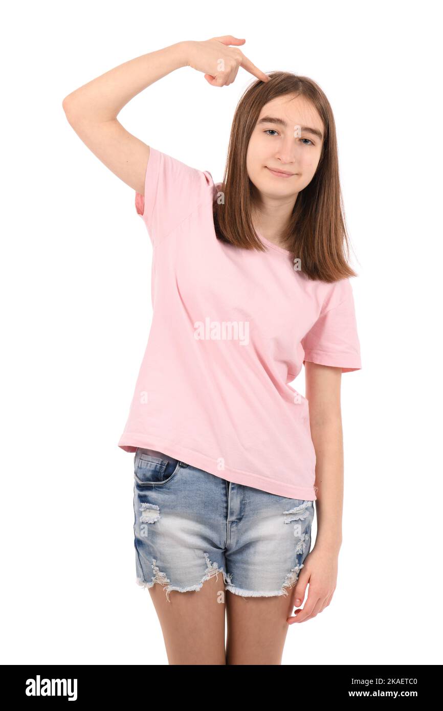 Young Beautiful Girl In A Pink T Shirt And Denim Shorts On A White Background Confuse And