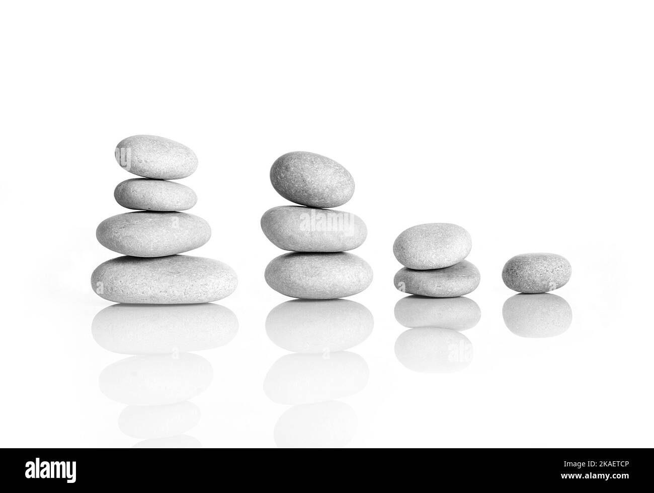 white pebbles arrangement on white background Stock Photo - Alamy