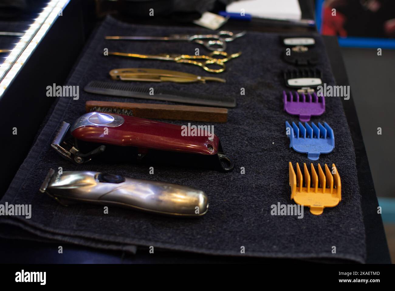 A closeup of a barber, hair cutting kit set including hair clippers and ...