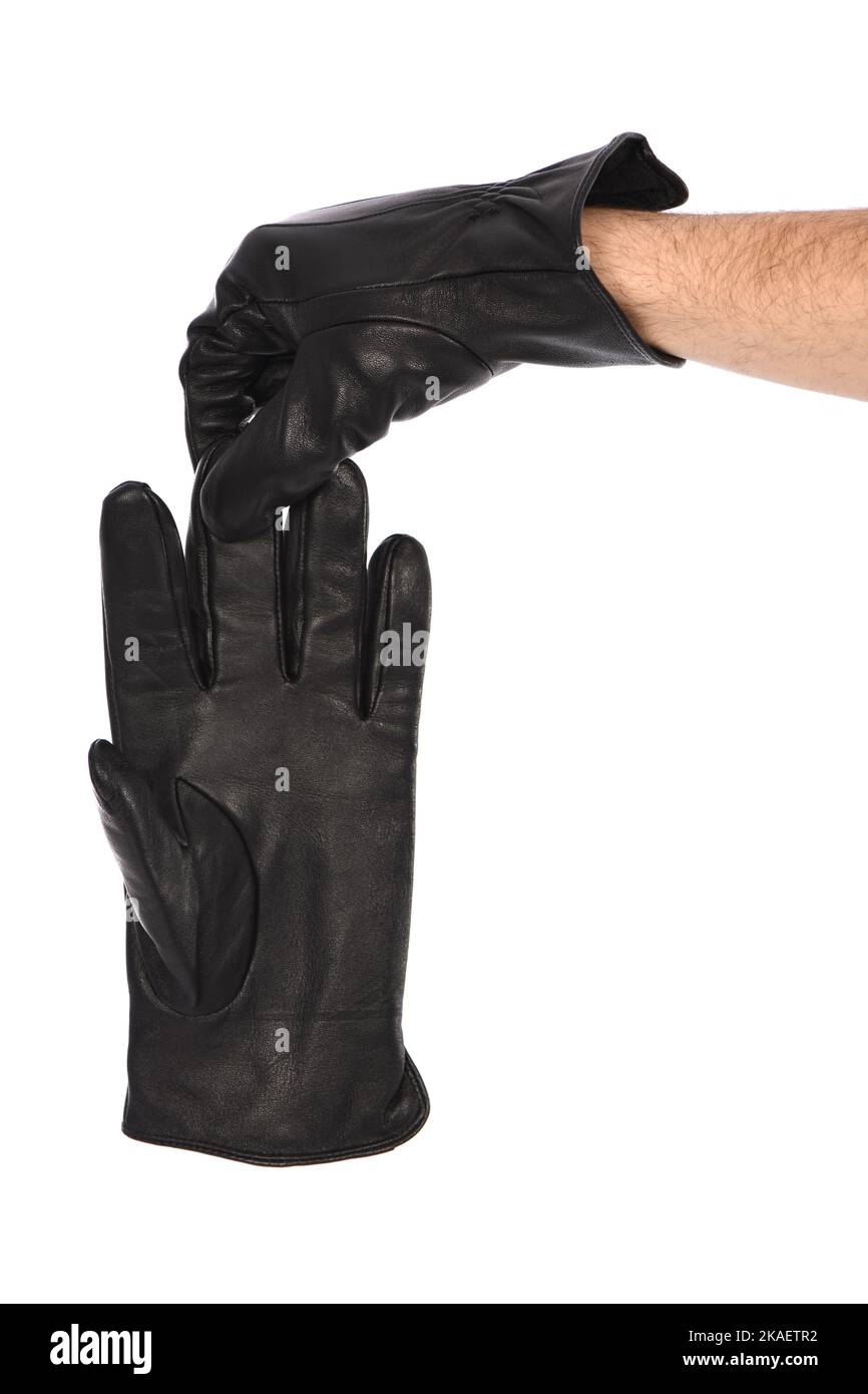 Man wearing black leather glove on white background, closeup. Side view ...