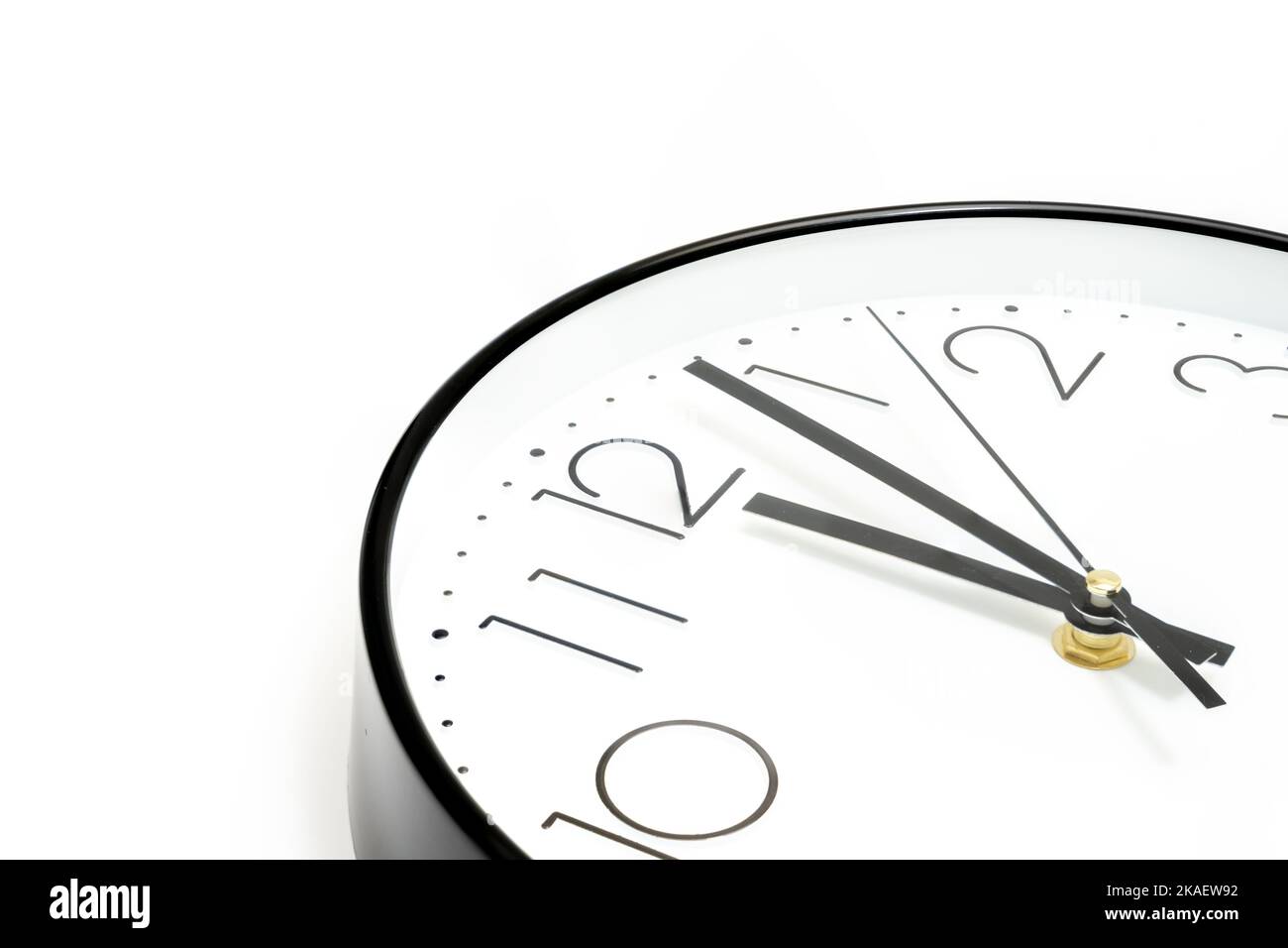 A white quartz clock with black numbers Stock Photo - Alamy