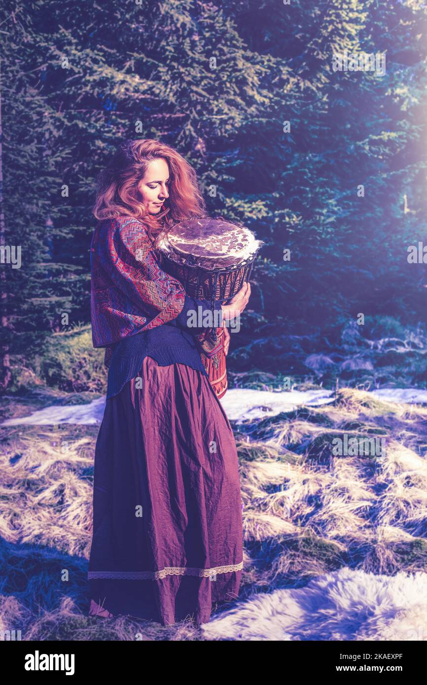 Beautiful Shamanic Girl Playing On African Drum Drum In The Nature