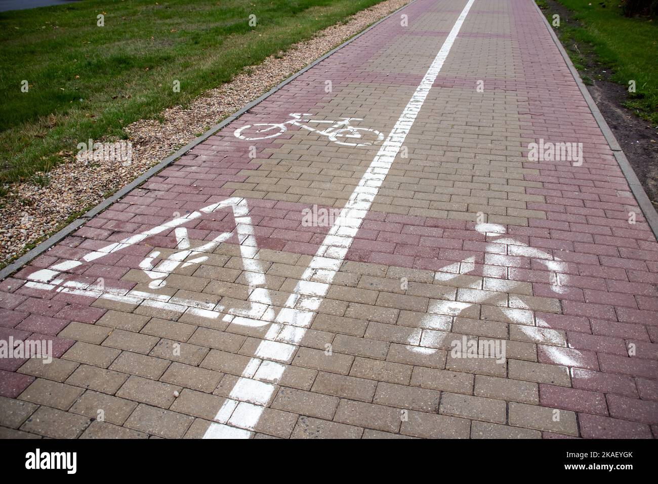 Bicycle path sign on paving slabs close up Stock Photo - Alamy