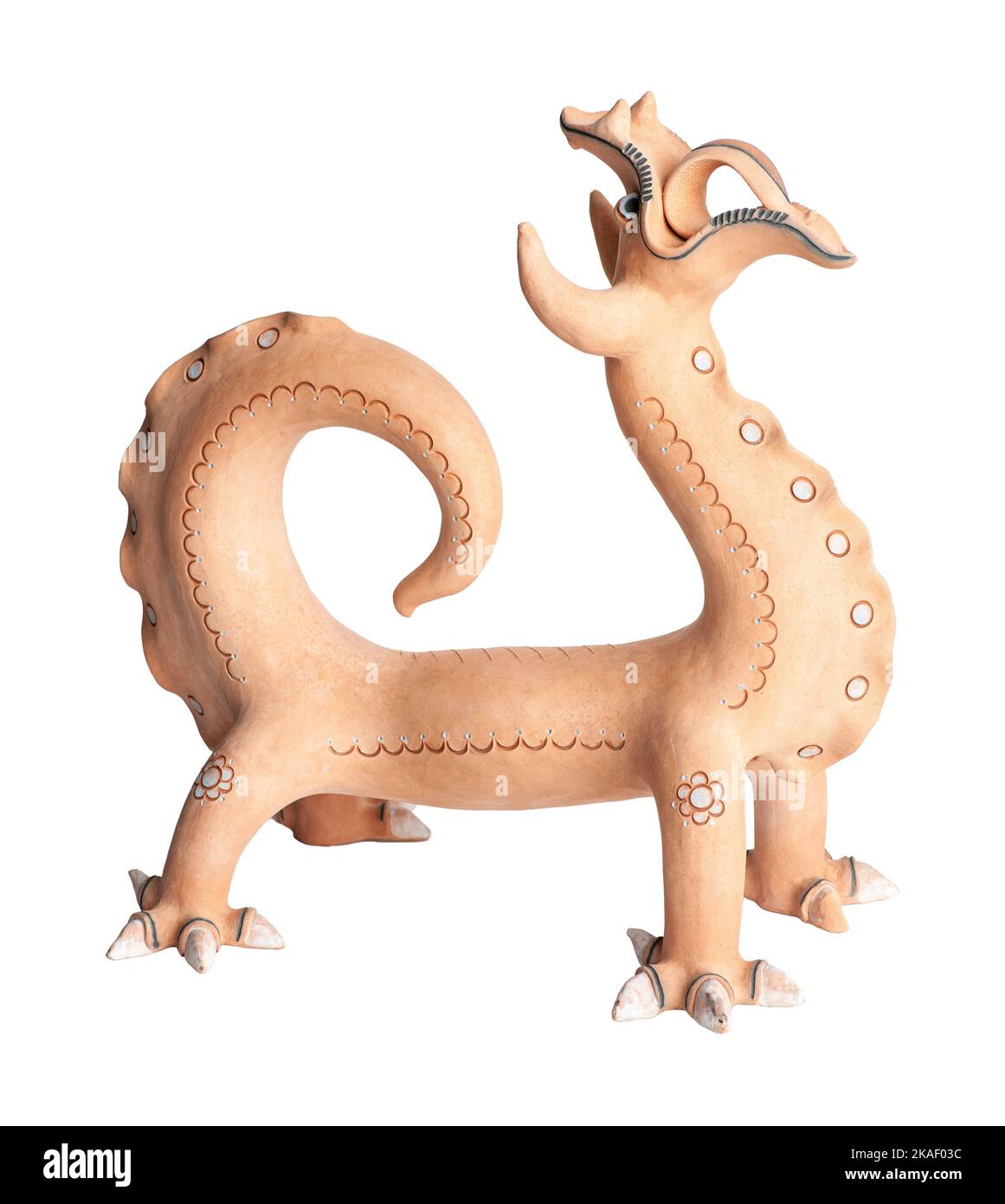 A dragon clay oriental souvenir on a white background Stock Photo - Alamy