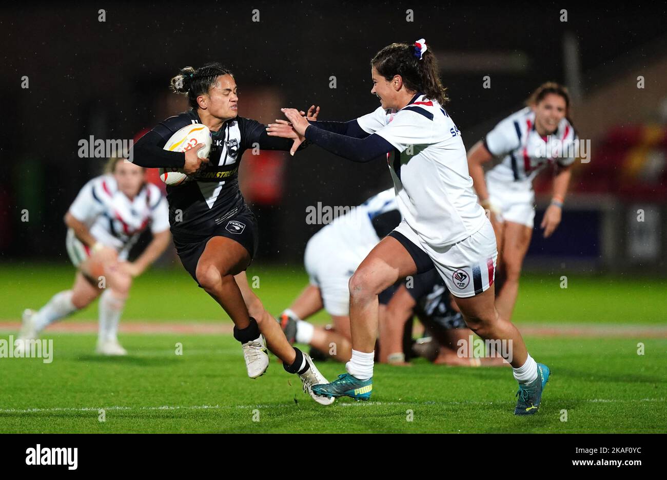 New Zealand's Nita Maynard is tackled by France's Manon Samarra during ...