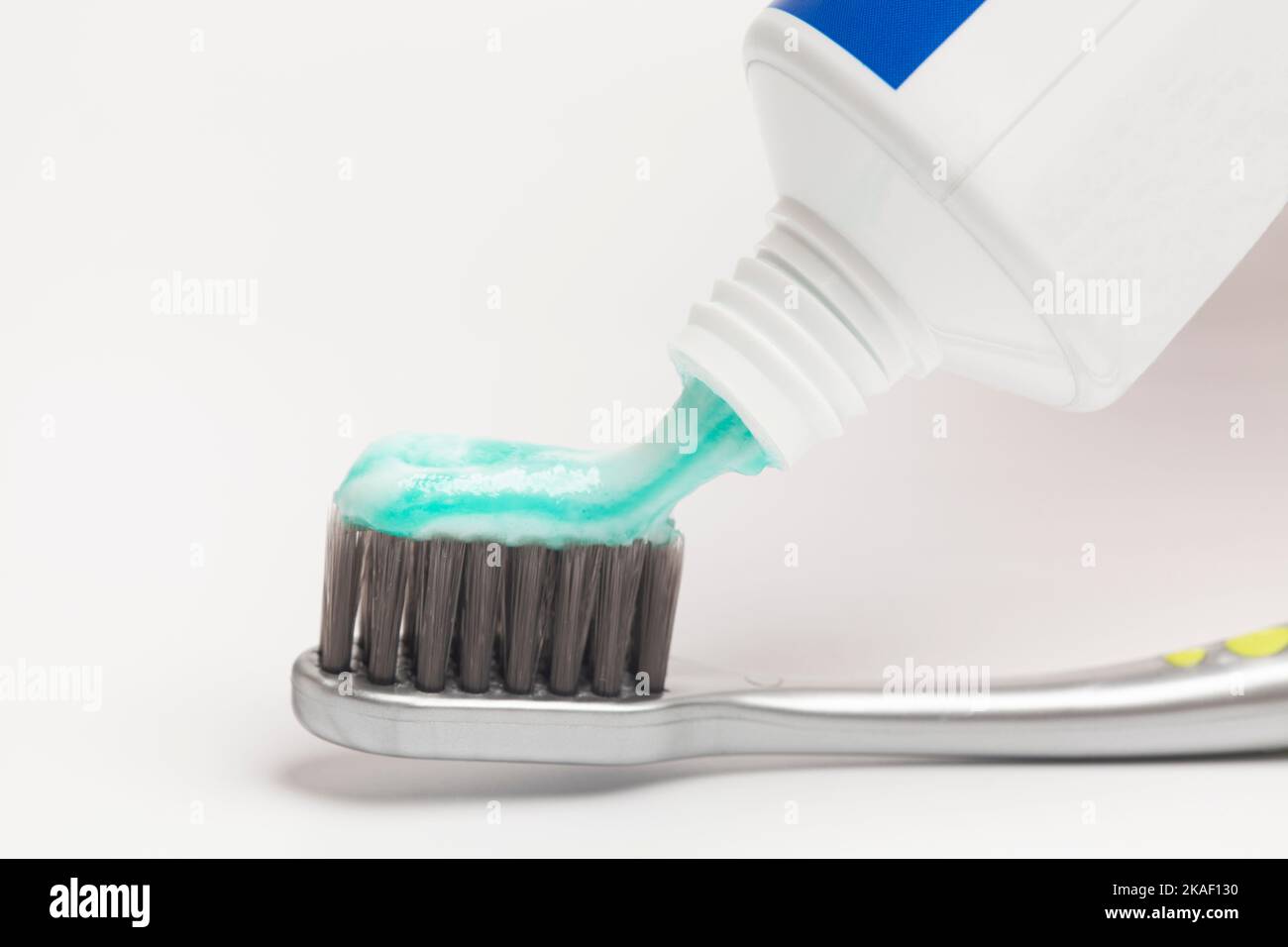 Squeezing tooth paste on toothbrush hi-res stock photography and images ...