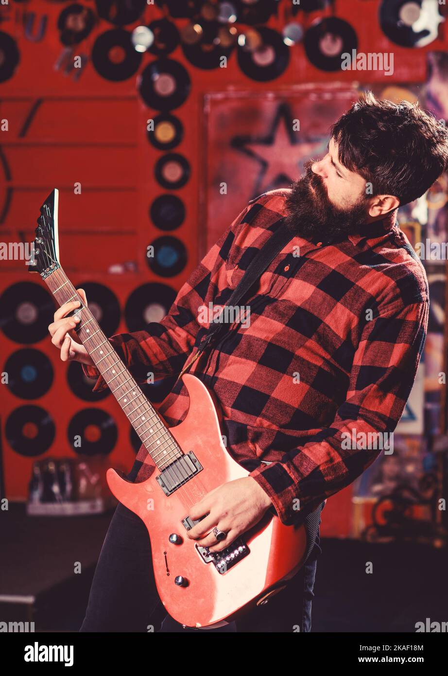 Young rock musician, singer, talented artist. Guitar player concept ...