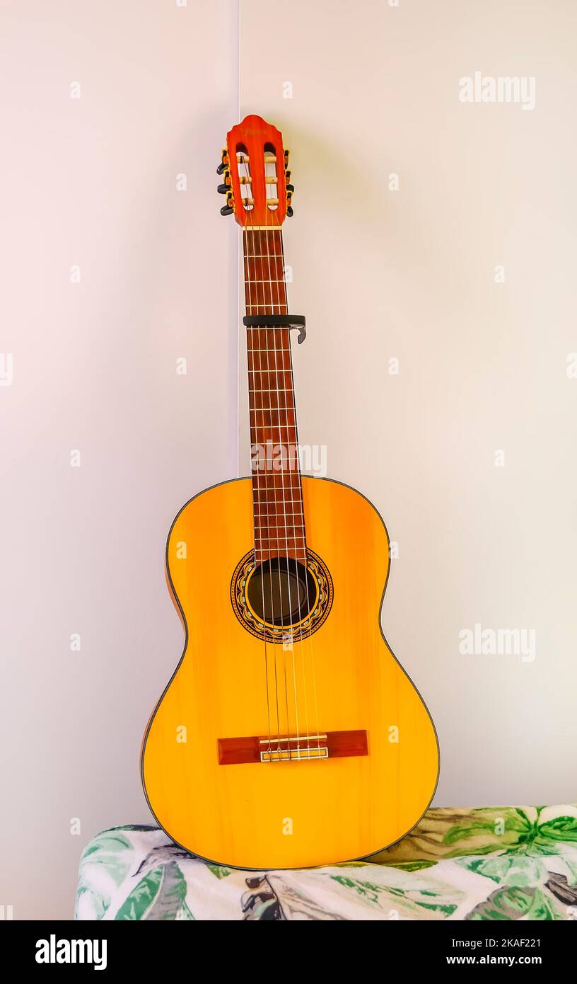 Classic guitar in the room interior Stock Photo - Alamy