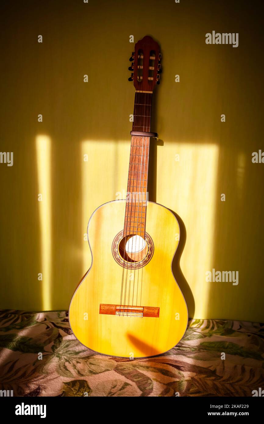 Classic guitar in the room interior Stock Photo - Alamy