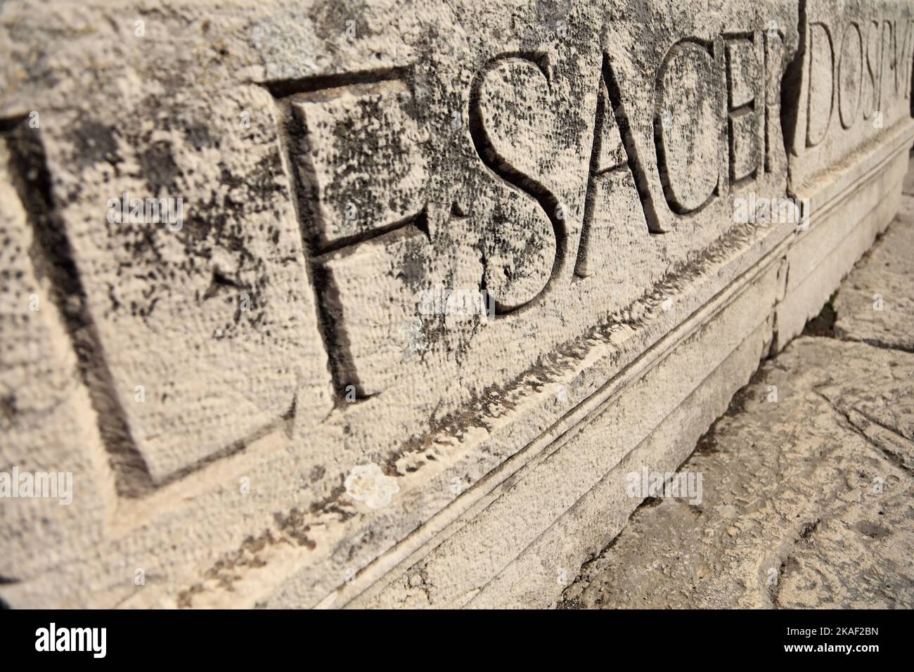 Latin inscription on broken stonework in the Pompeii ruins, Italy Stock ...