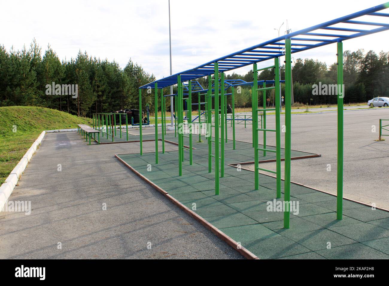 Sports outdoor playground with exercise equipment outside the city ...