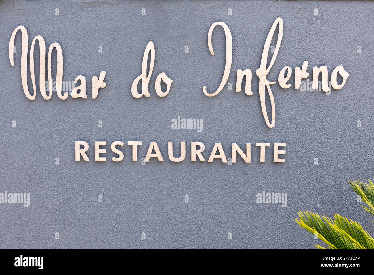 An advertising board for the Mar do Inferno restaurant, next to Boca do ...